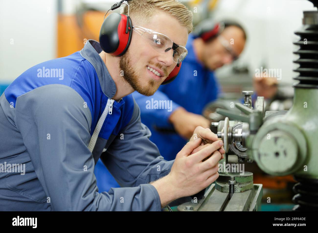 industrial worker inspecting work piece Stock Photo - Alamy