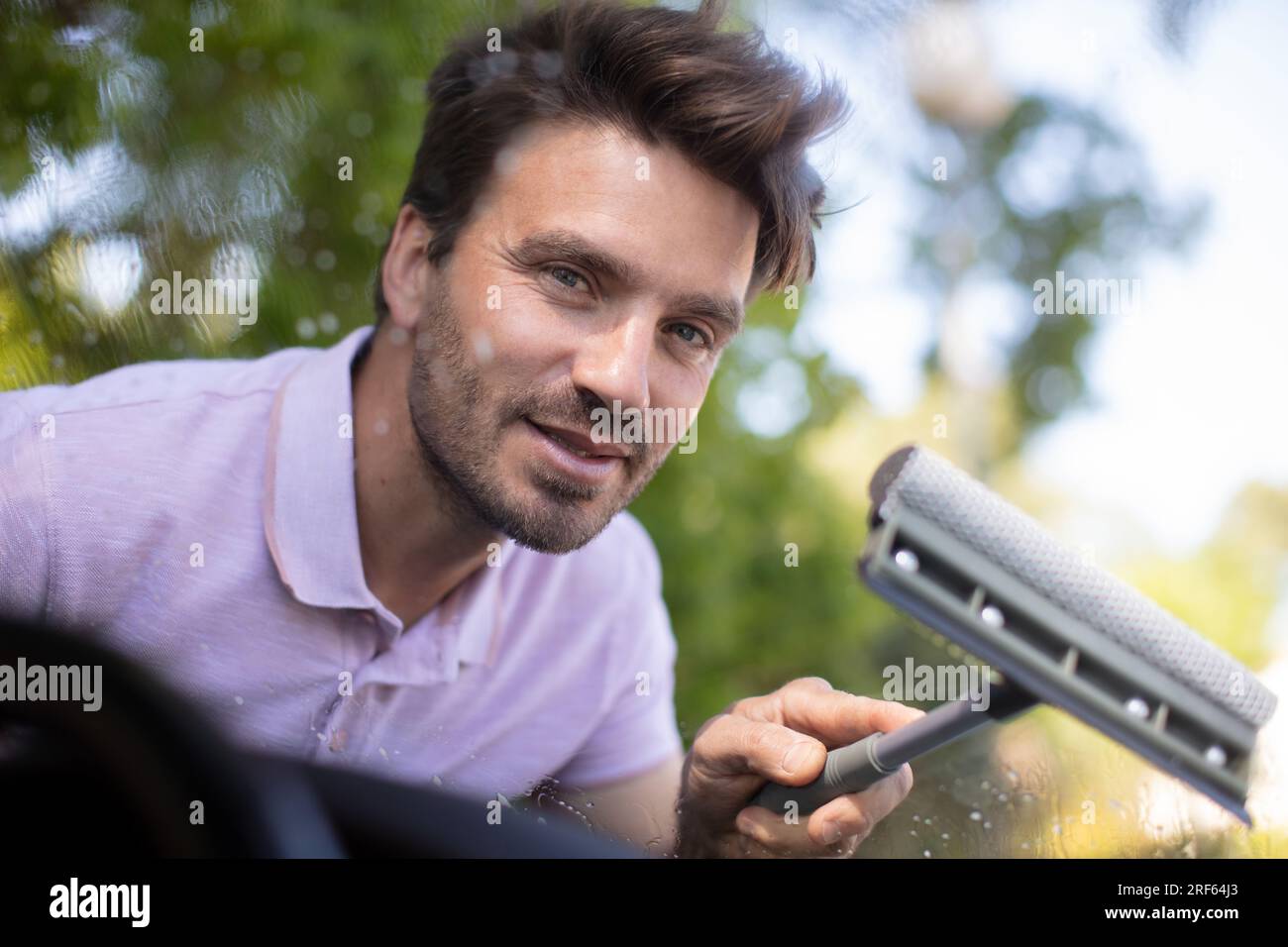 man wash a car inside car camera view Stock Photo - Alamy