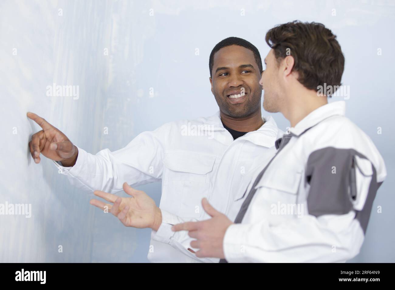 craftsman and young apprentice working together Stock Photo - Alamy