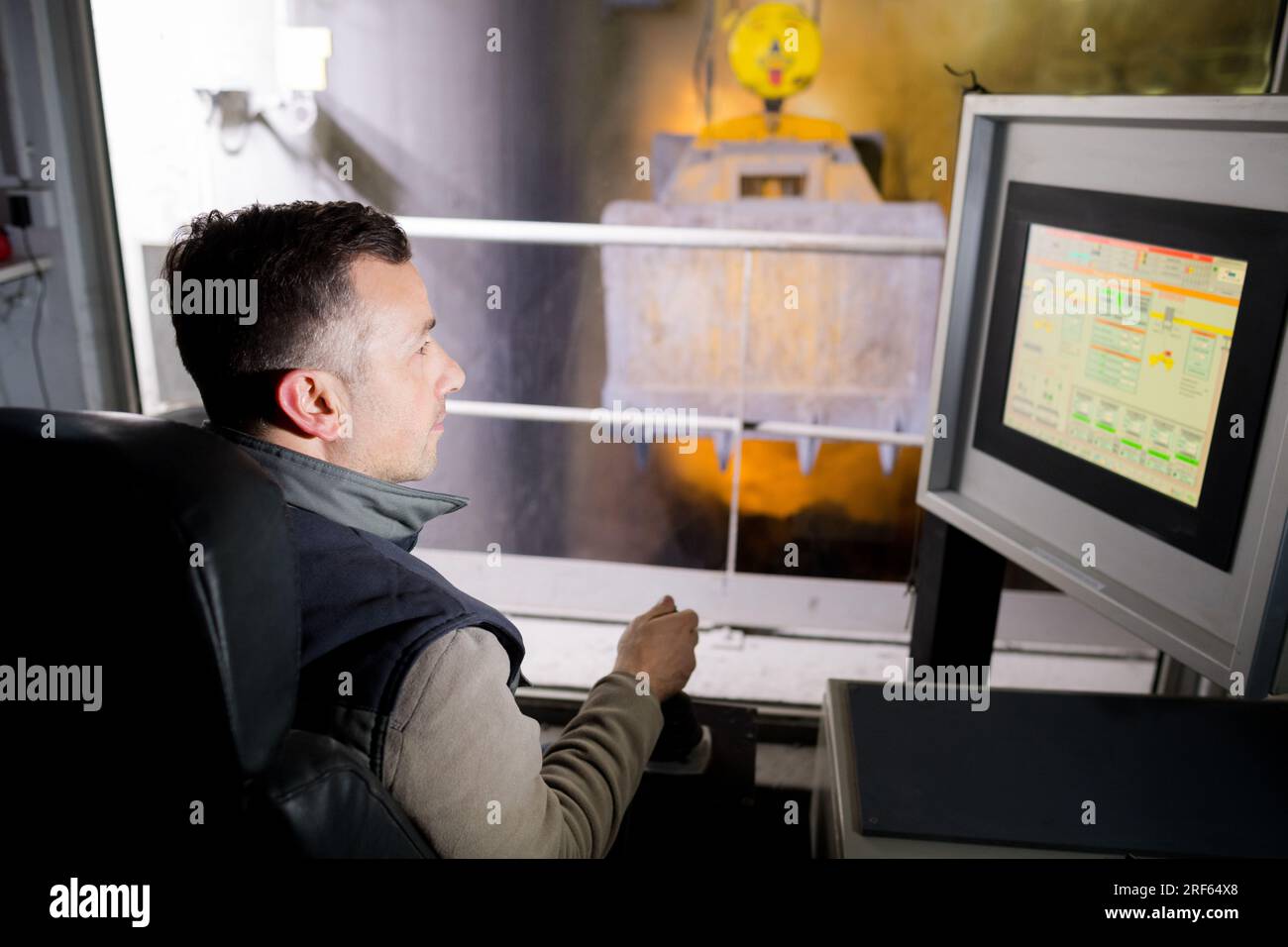 man controlling robotic arms with computer Stock Photo - Alamy