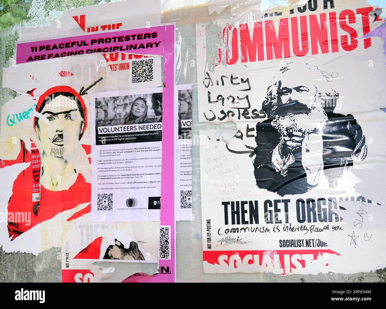 ripped or torn posters and graffiti on them at the University of ...