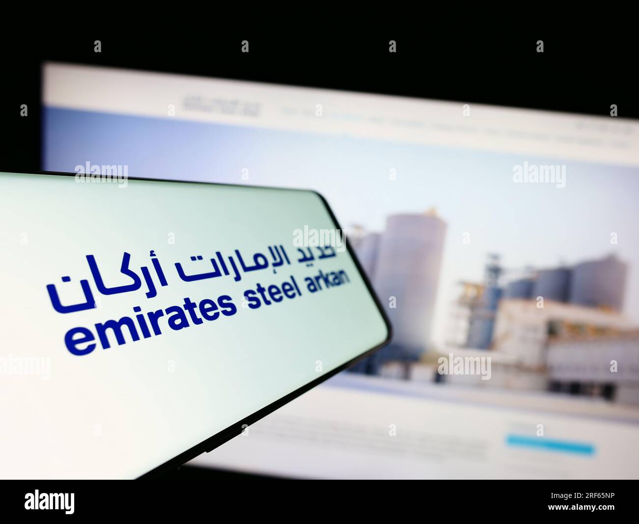 Cellphone with logo of company Emirates Steel Arkan (UAE) on screen in ...