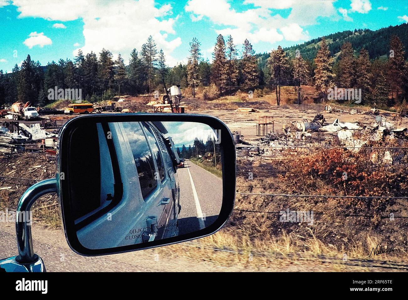 View from a moving vehicle through the passenger side window with a ...