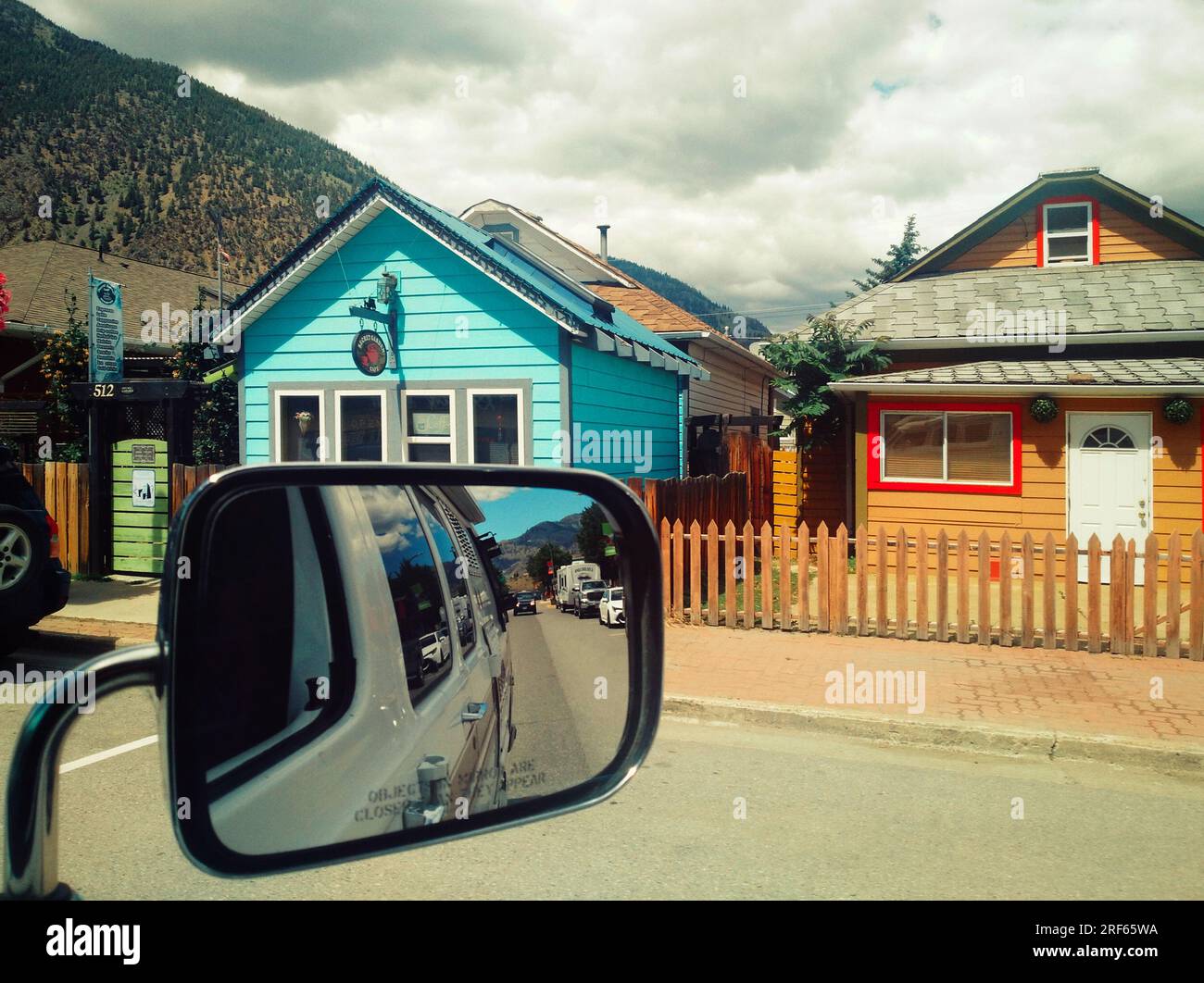 View from a side view or rare view mirror overlooking the buildings in ...