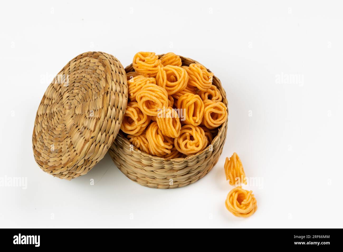 MURUKKU, Small spiral murukku which is very spicy and tasty, isolated ...