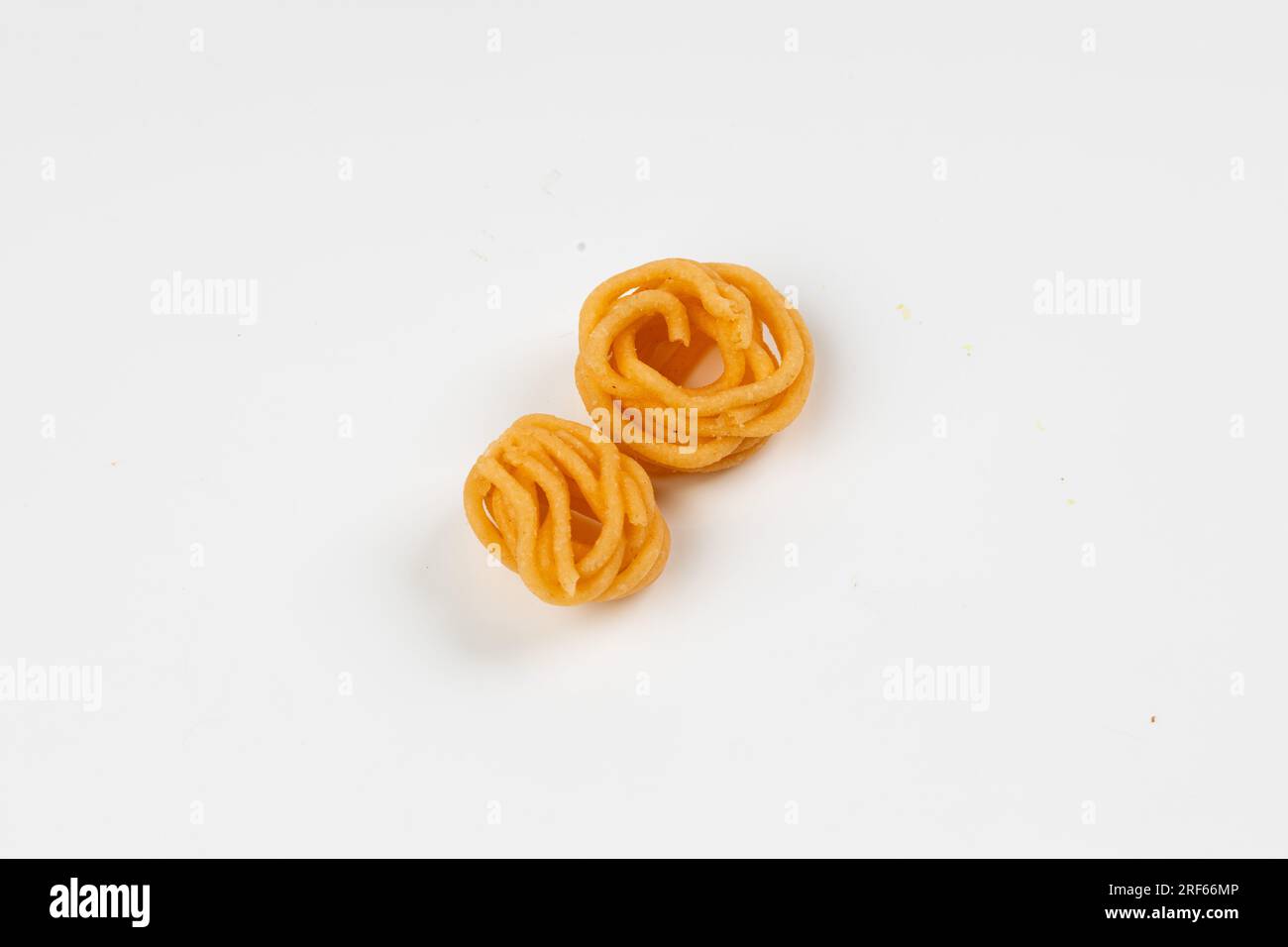 MURUKKU, Small spiral murukku which is very spicy and tasty, isolated ...
