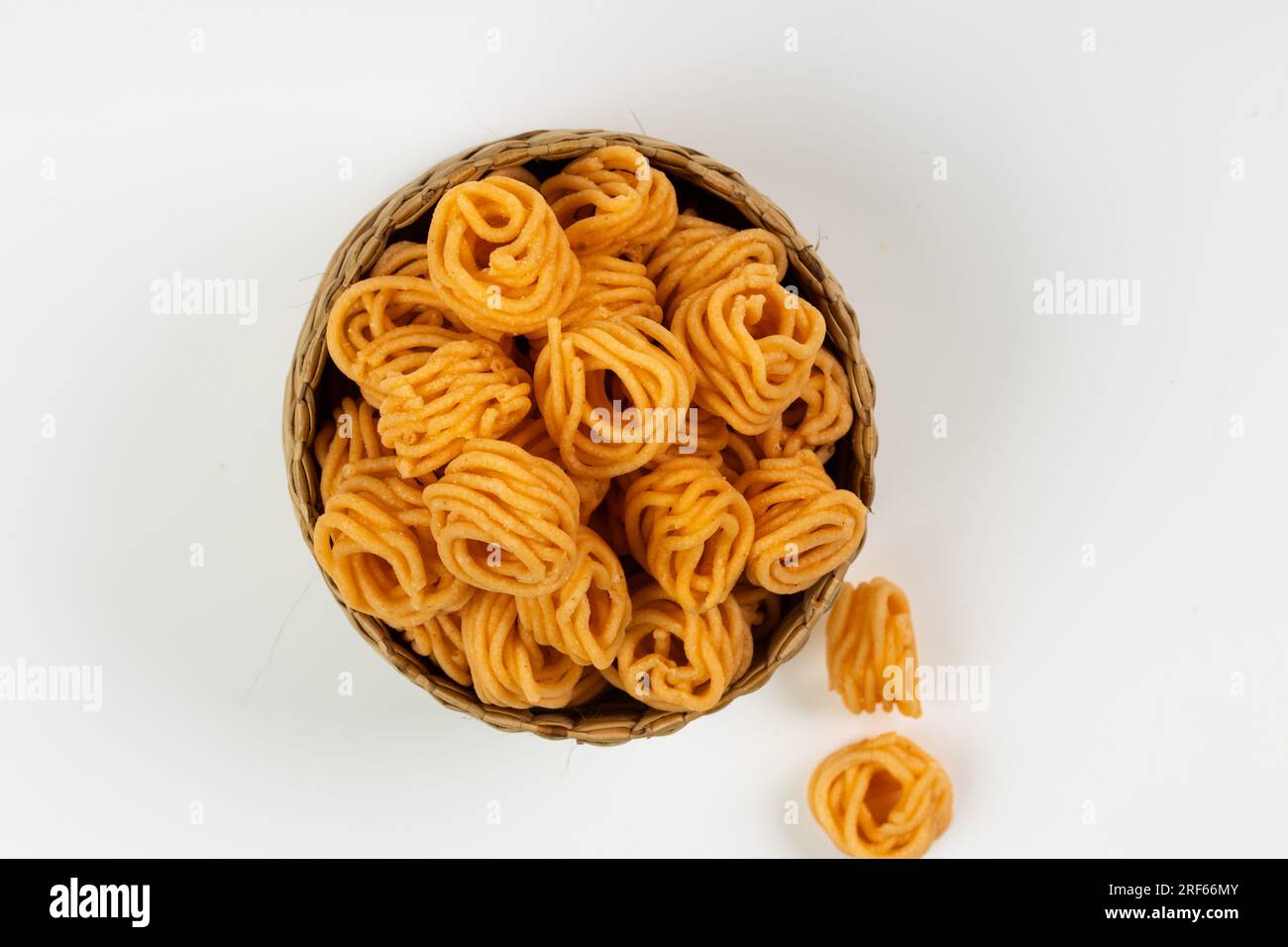 MURUKKU, Small spiral murukku which is very spicy and tasty, isolated ...