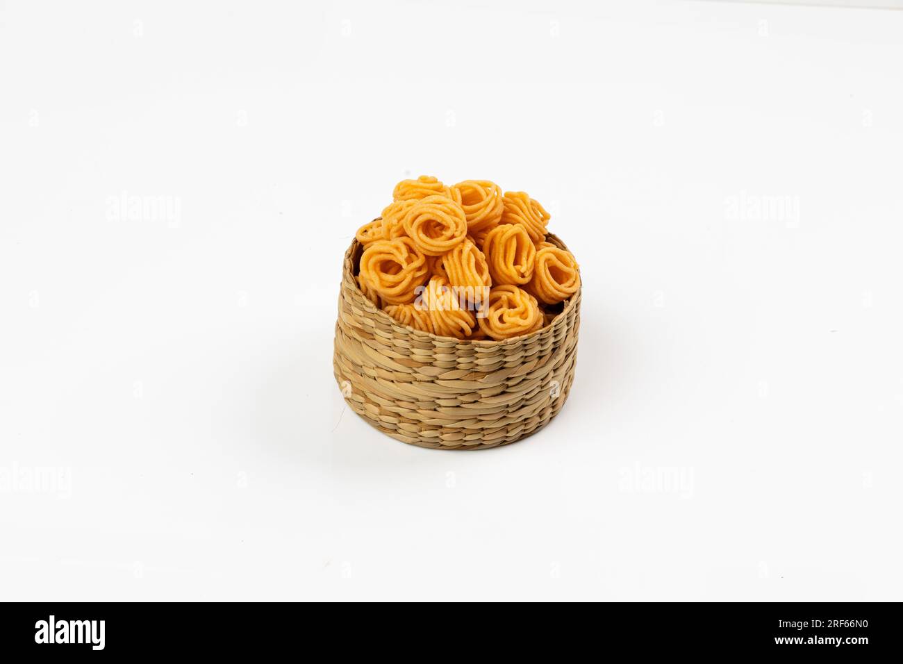 MURUKKU, Small spiral murukku which is very spicy and tasty, isolated ...