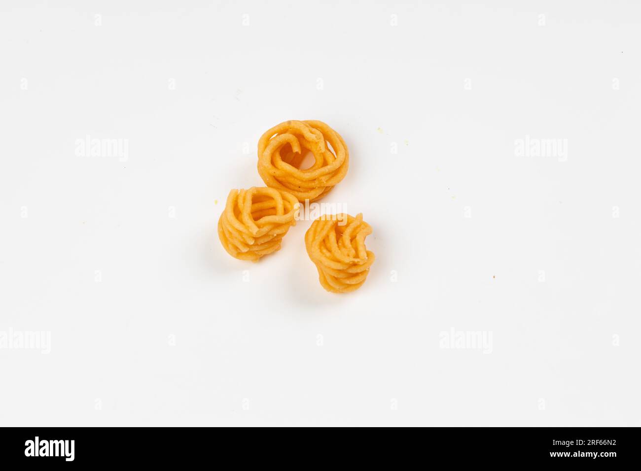 MURUKKU, Small spiral murukku which is very spicy and tasty, isolated ...