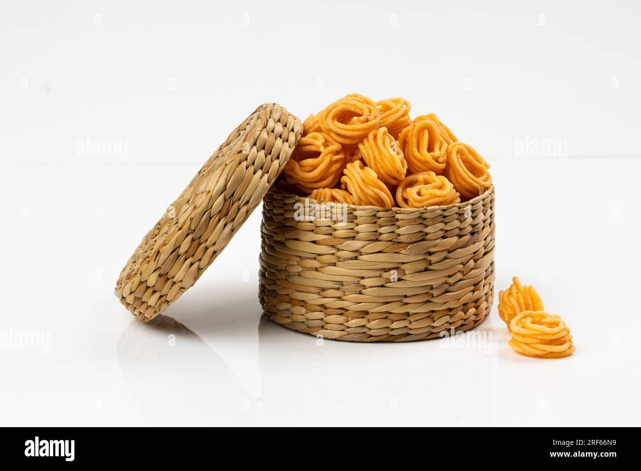 MURUKKU, Small spiral murukku which is very spicy and tasty, isolated ...