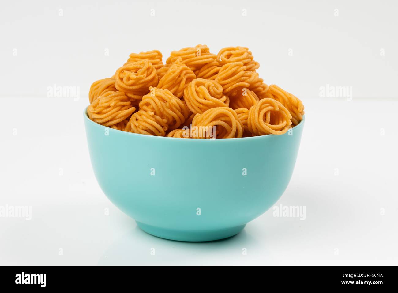 MURUKKU, Small spiral murukku which is very spicy and tasty, isolated ...