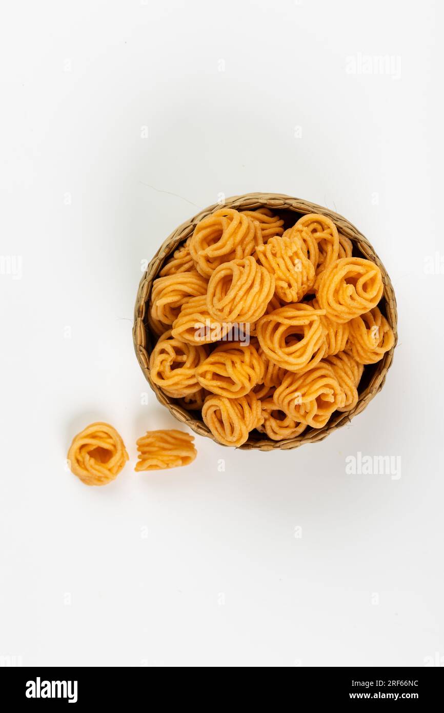 MURUKKU, Small spiral murukku which is very spicy and tasty, isolated ...