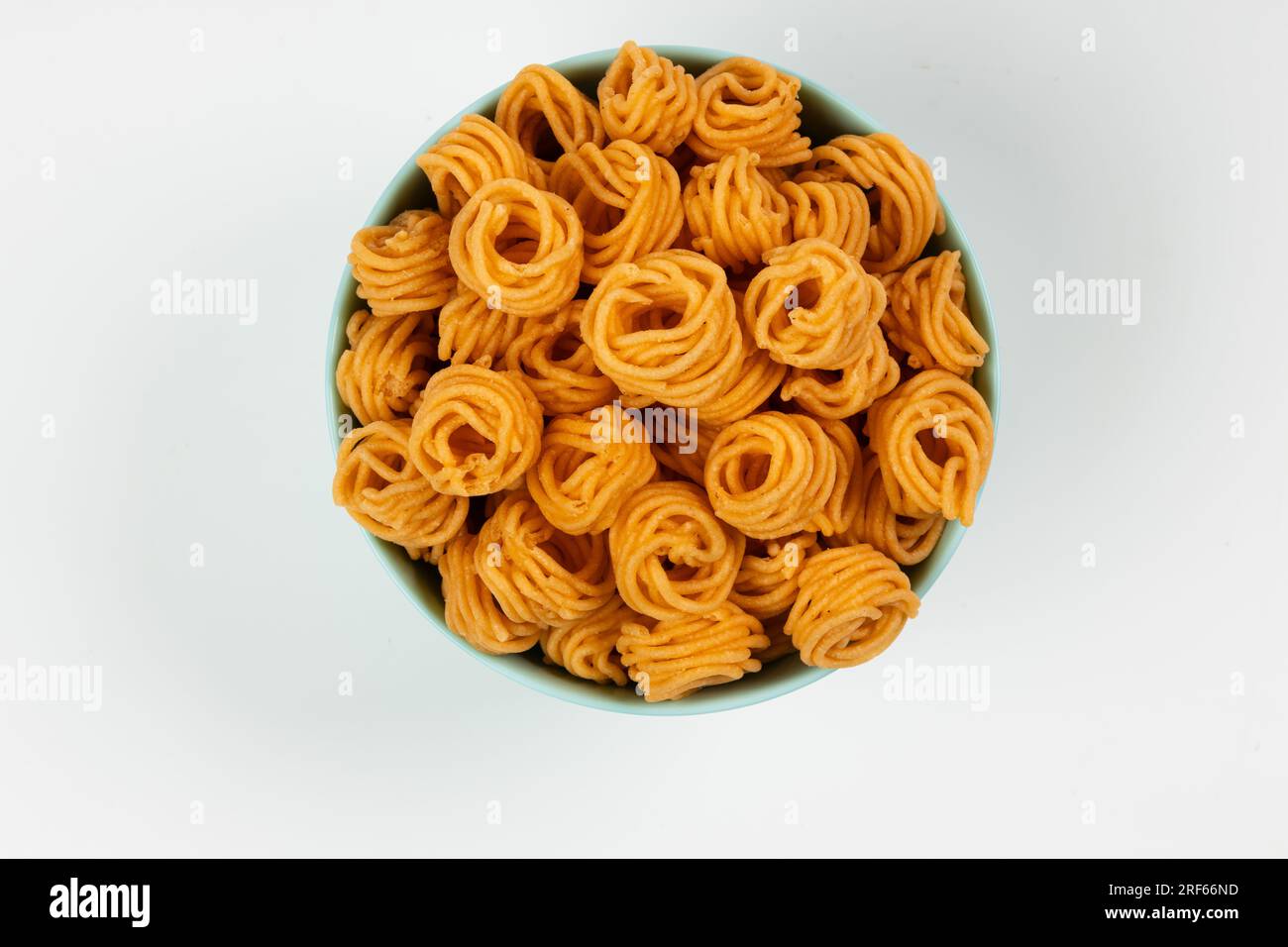 MURUKKU, Small spiral murukku which is very spicy and tasty, isolated ...