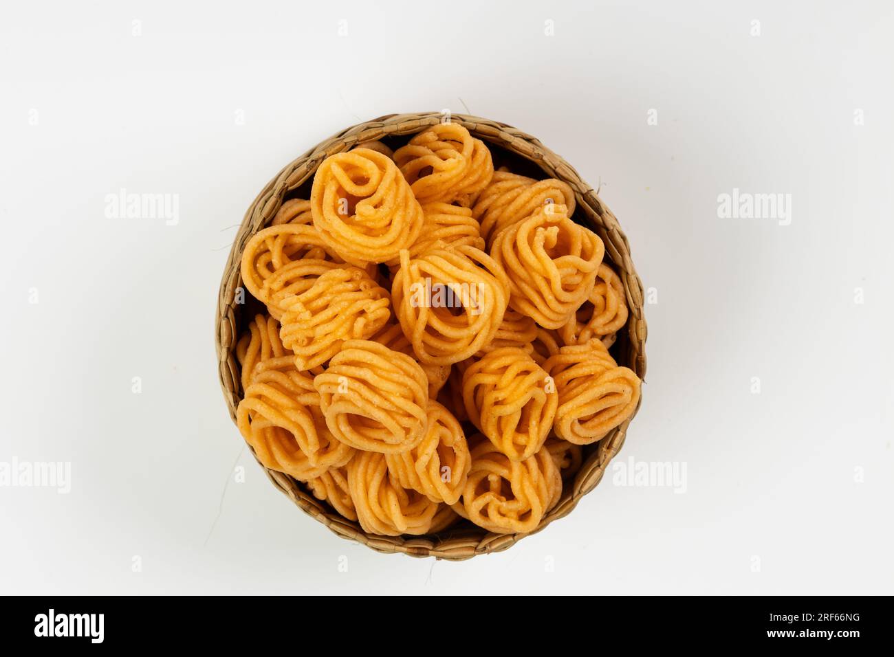 MURUKKU, Small spiral murukku which is very spicy and tasty, isolated ...
