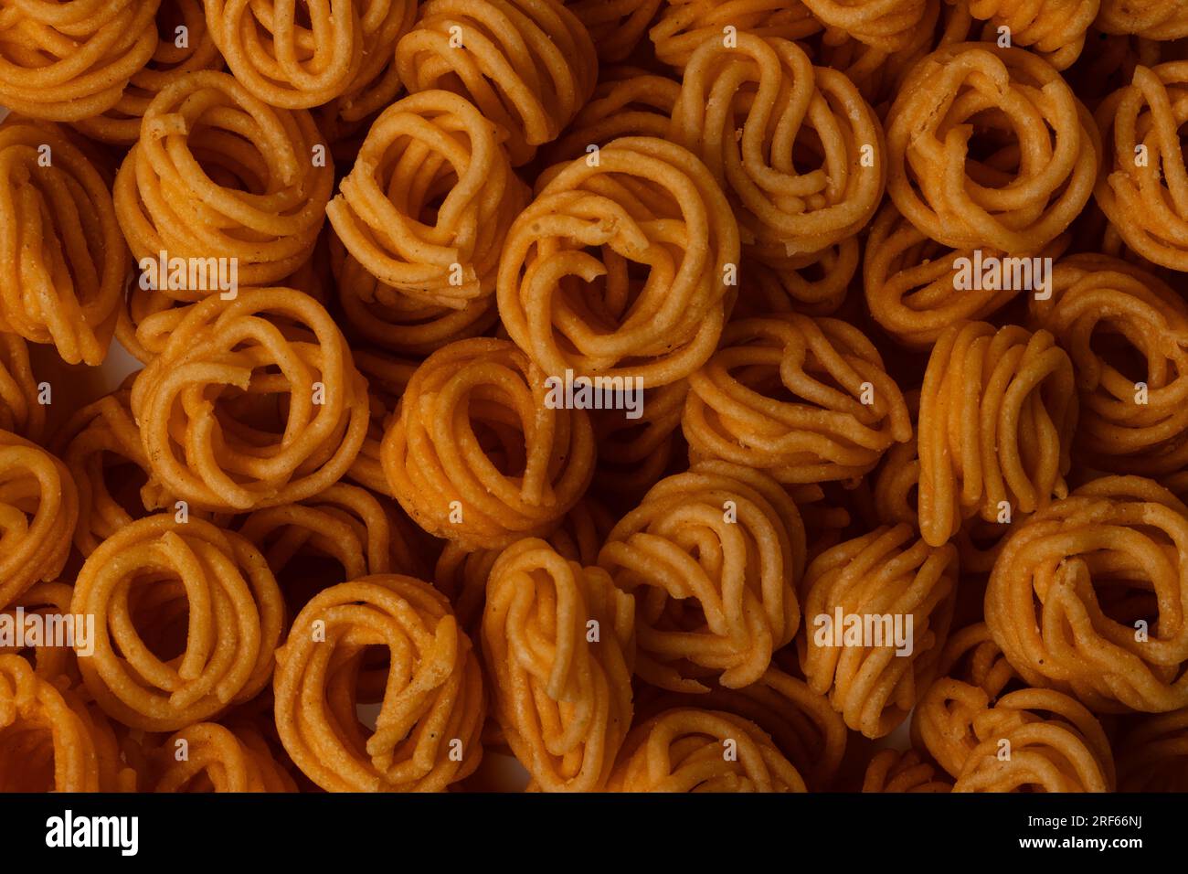 MURUKKU, Small spiral murukku which is very spicy and tasty, isolated ...