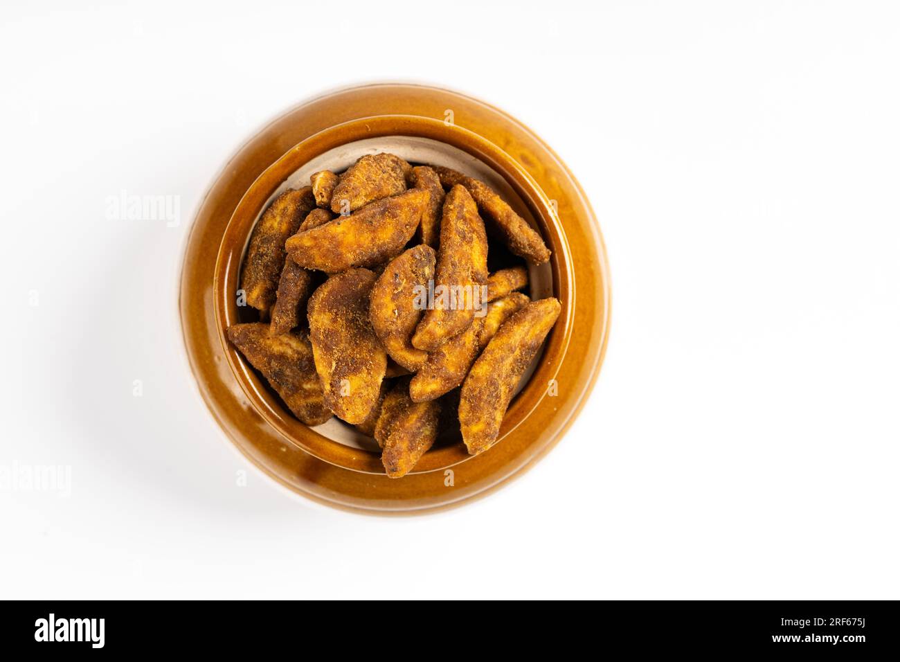 Sharkara Upperi or Sarkara Varatti, is a popular sweet snack from Kerala, isolated images with ...