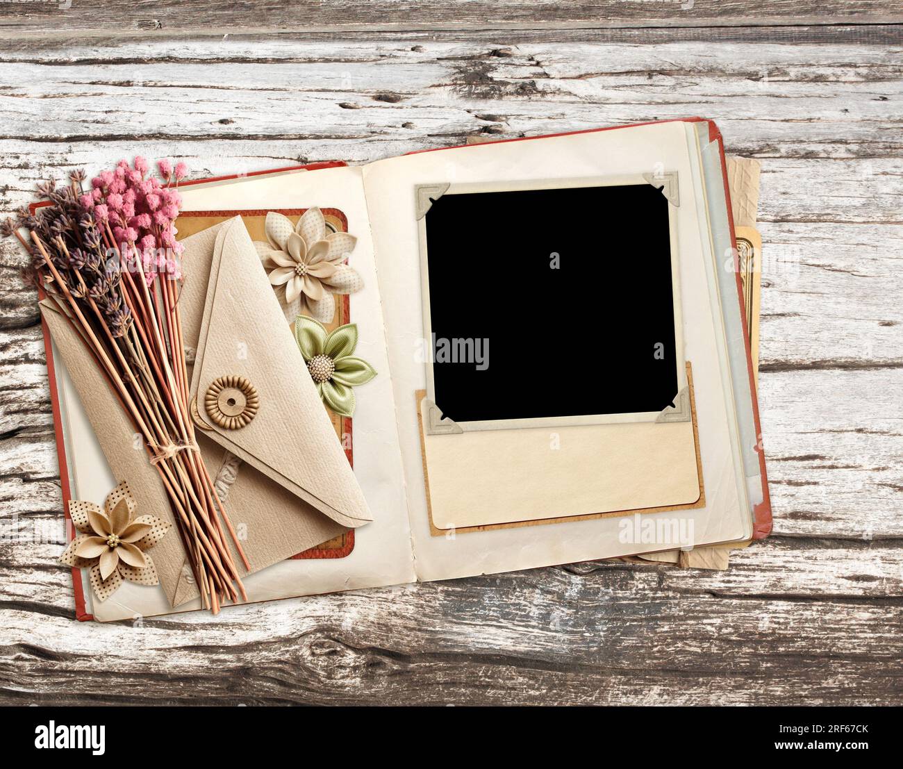 Retro book with photo, dry leaf, vintage envelope and paper card on old ...