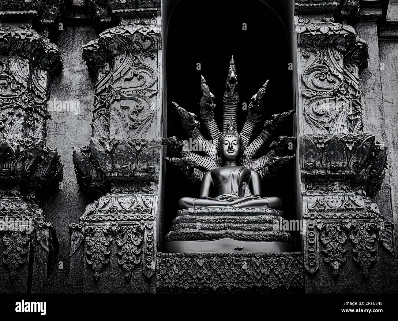 Small Buddha with 9 snakes Stock Photo - Alamy