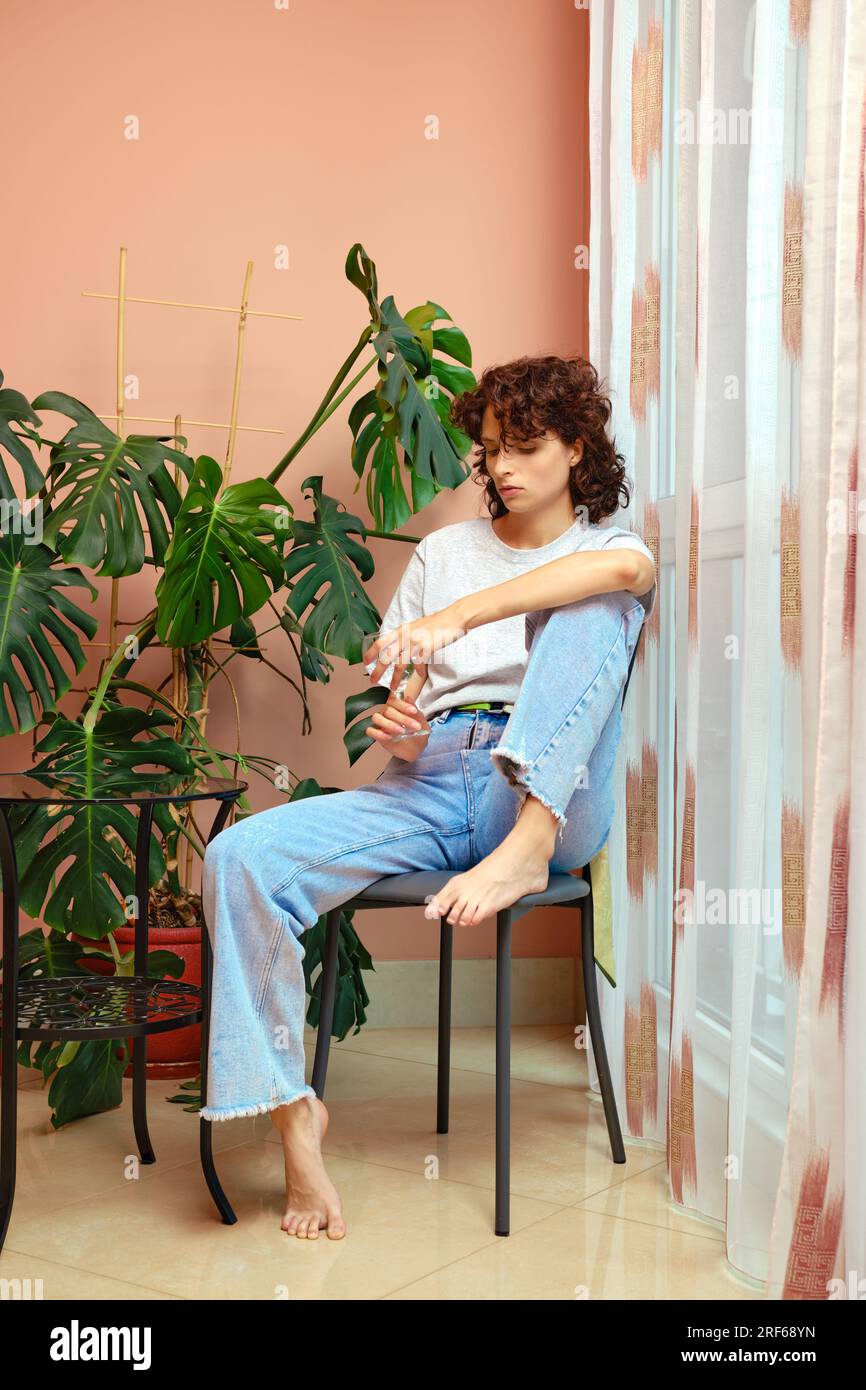 Sad woman regrets what she did thinks what to do next Stock Photo - Alamy