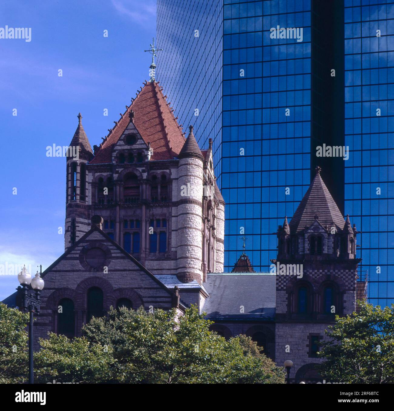 USA, Massachusetts, Boston, Trinity Church reflected in Hancock Tower ...