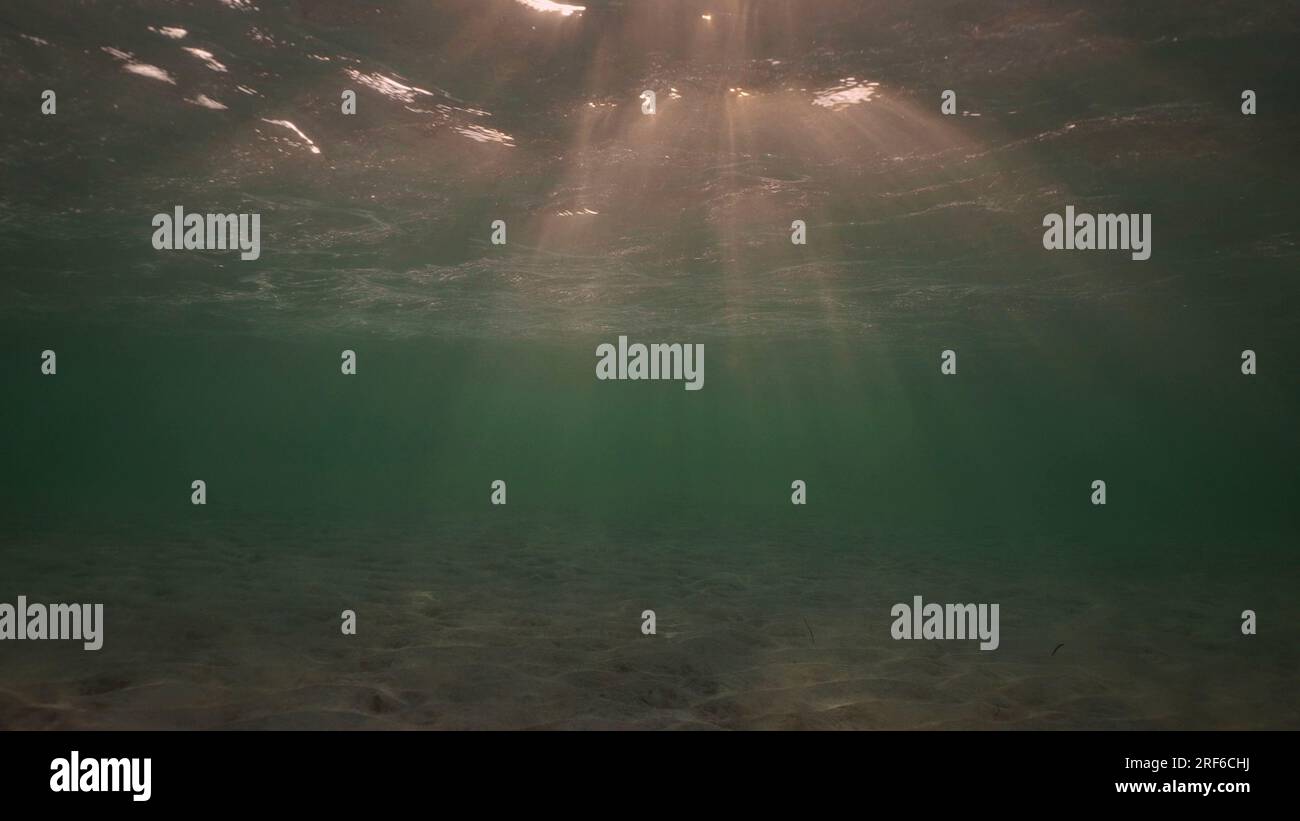 Red Sea, Egypt. 17th June, 2023. Low angle wide shot sun rays ...