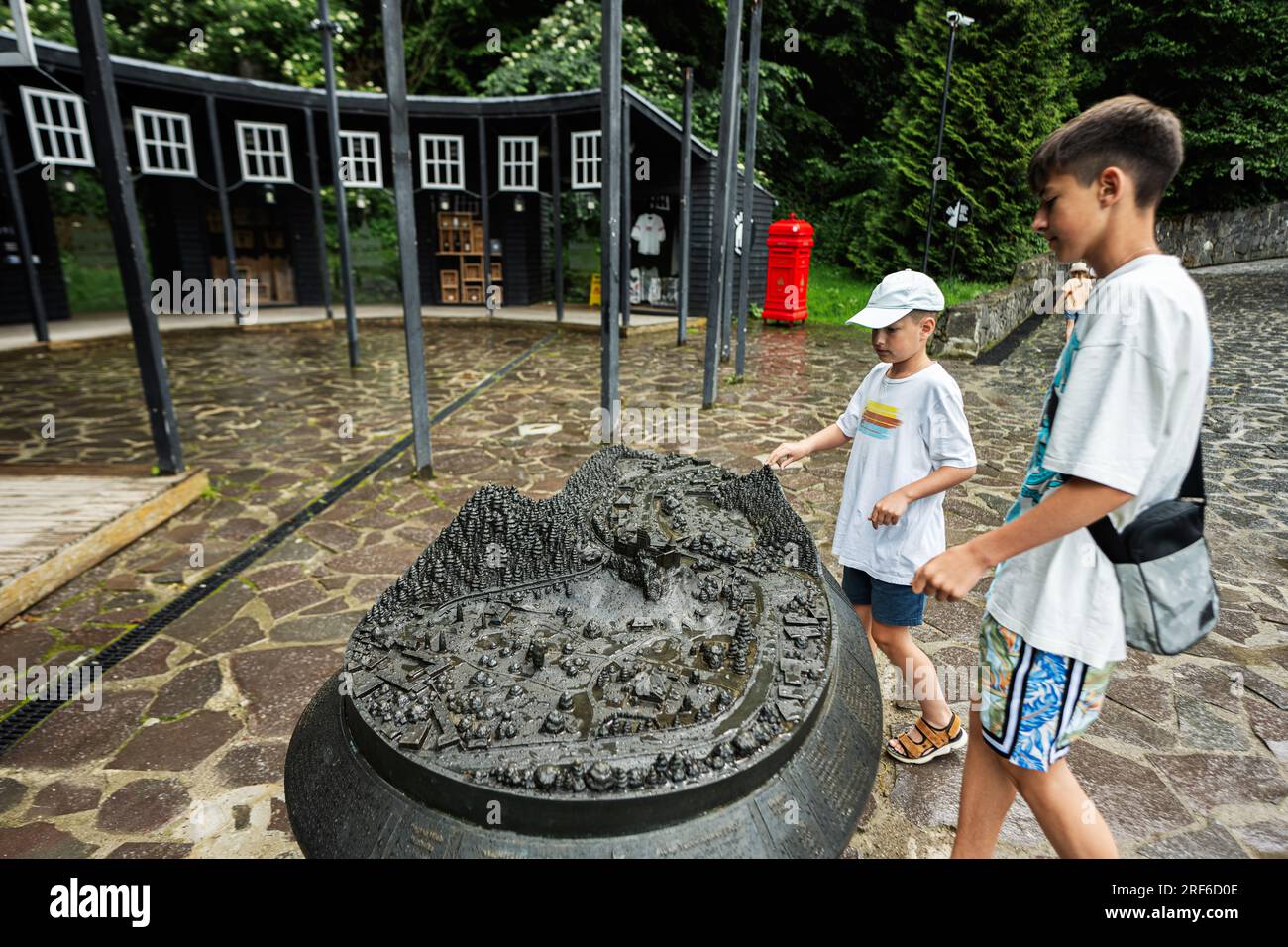 Kids looking in bronze layout of Bran castle, Transylvania, Romania ...