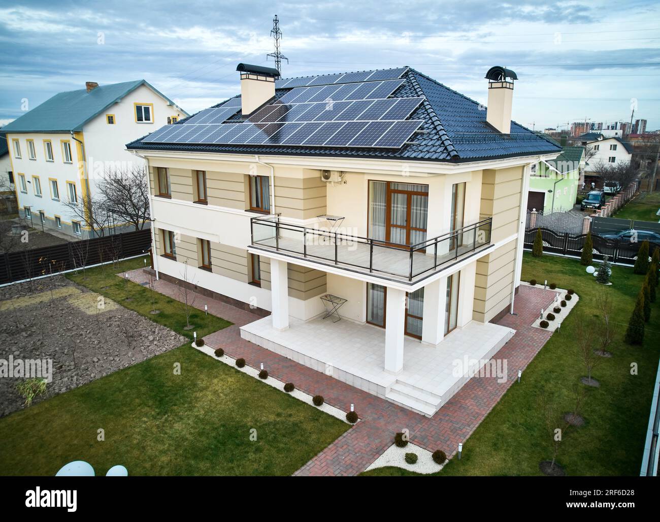 Residential house with photovoltaic solar panel modules on rooftop ...
