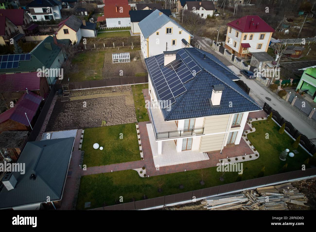 Aerial drone view of house with photovoltaic solar panels on rooftop ...
