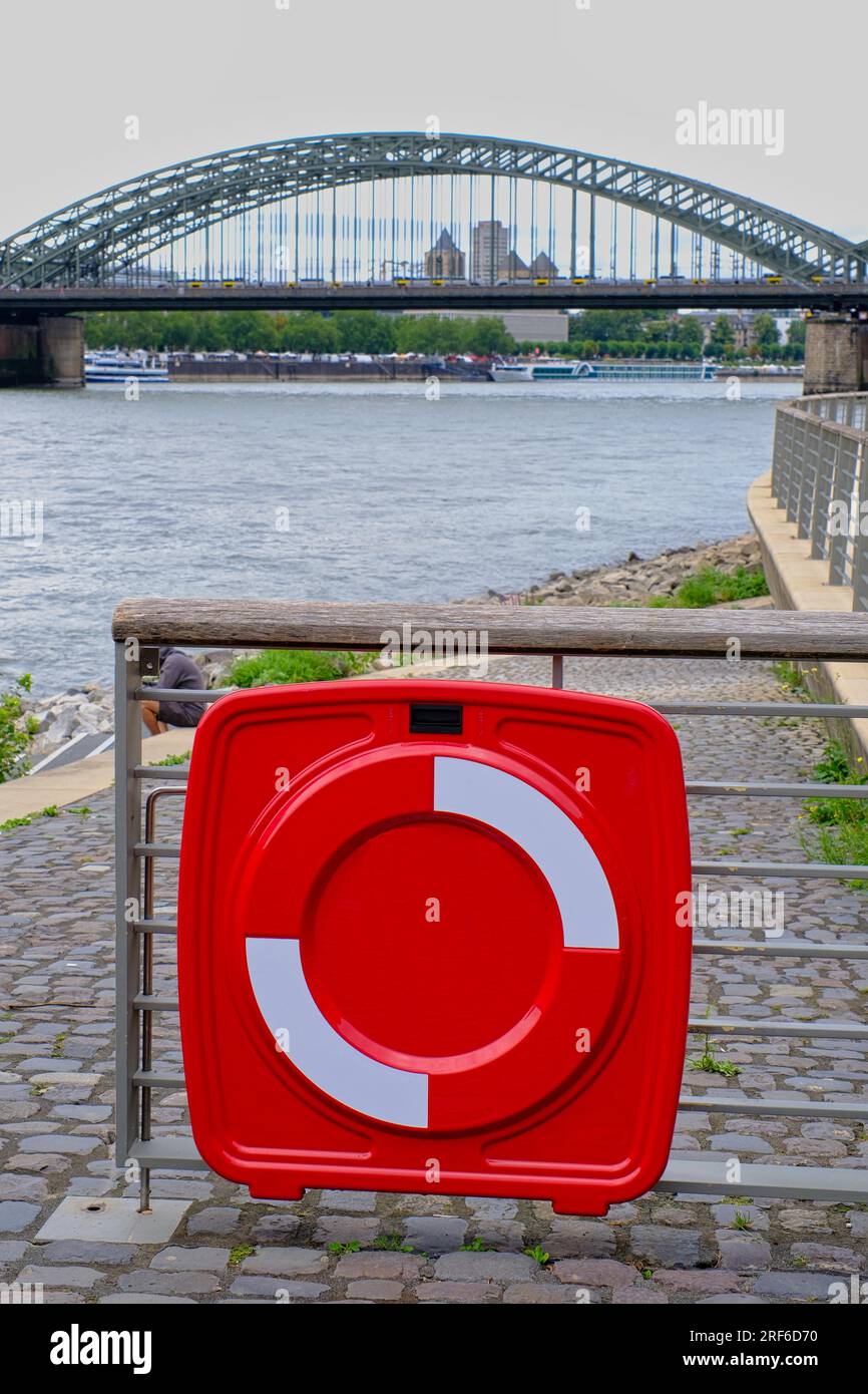 Lifebuoy on the Rhine promenade, bridge behind, Cologne, Germany Stock ...