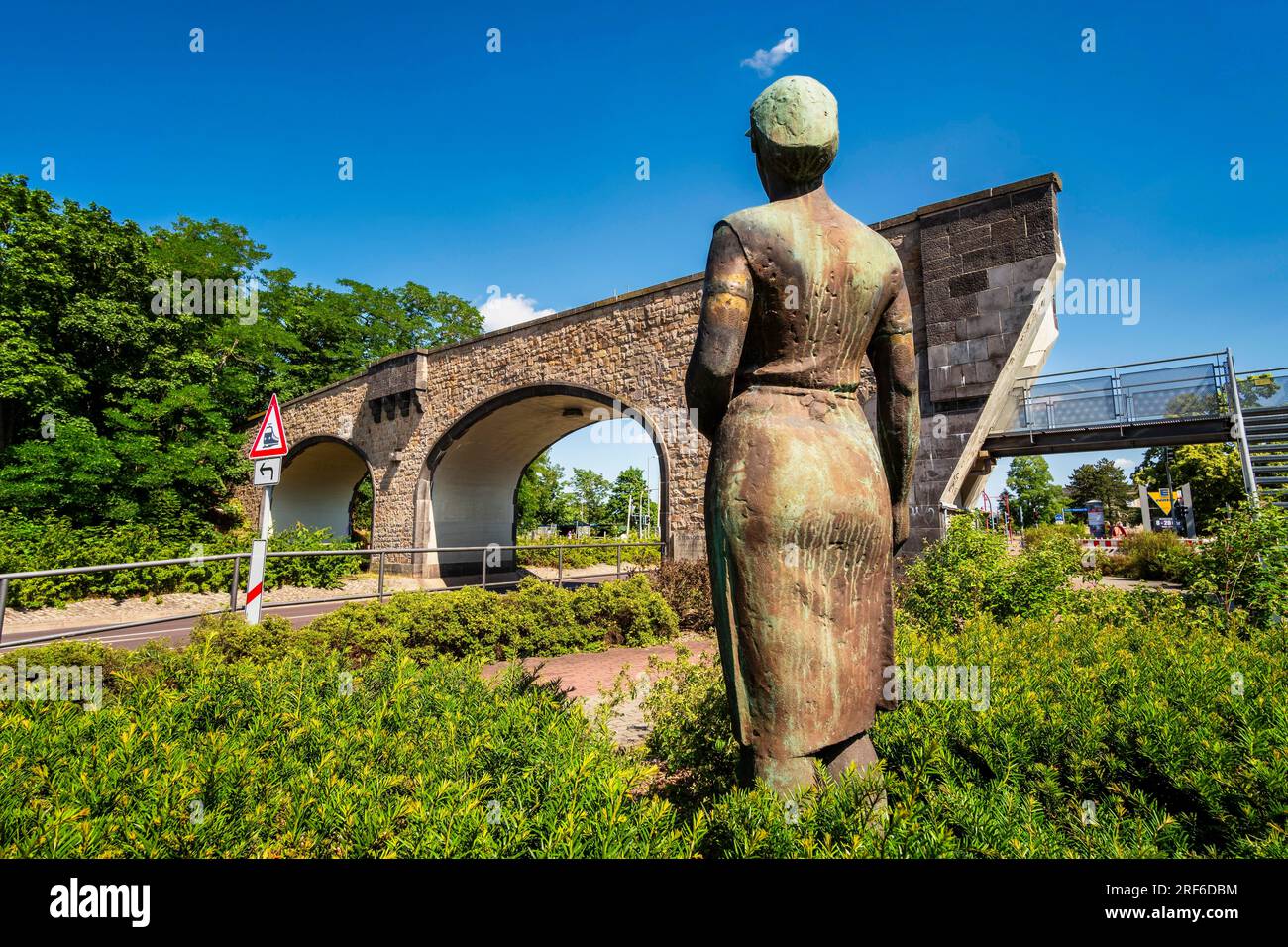 Sculpture Konerin in front of stone arch bridge Premnitz, Brandenburg ...
