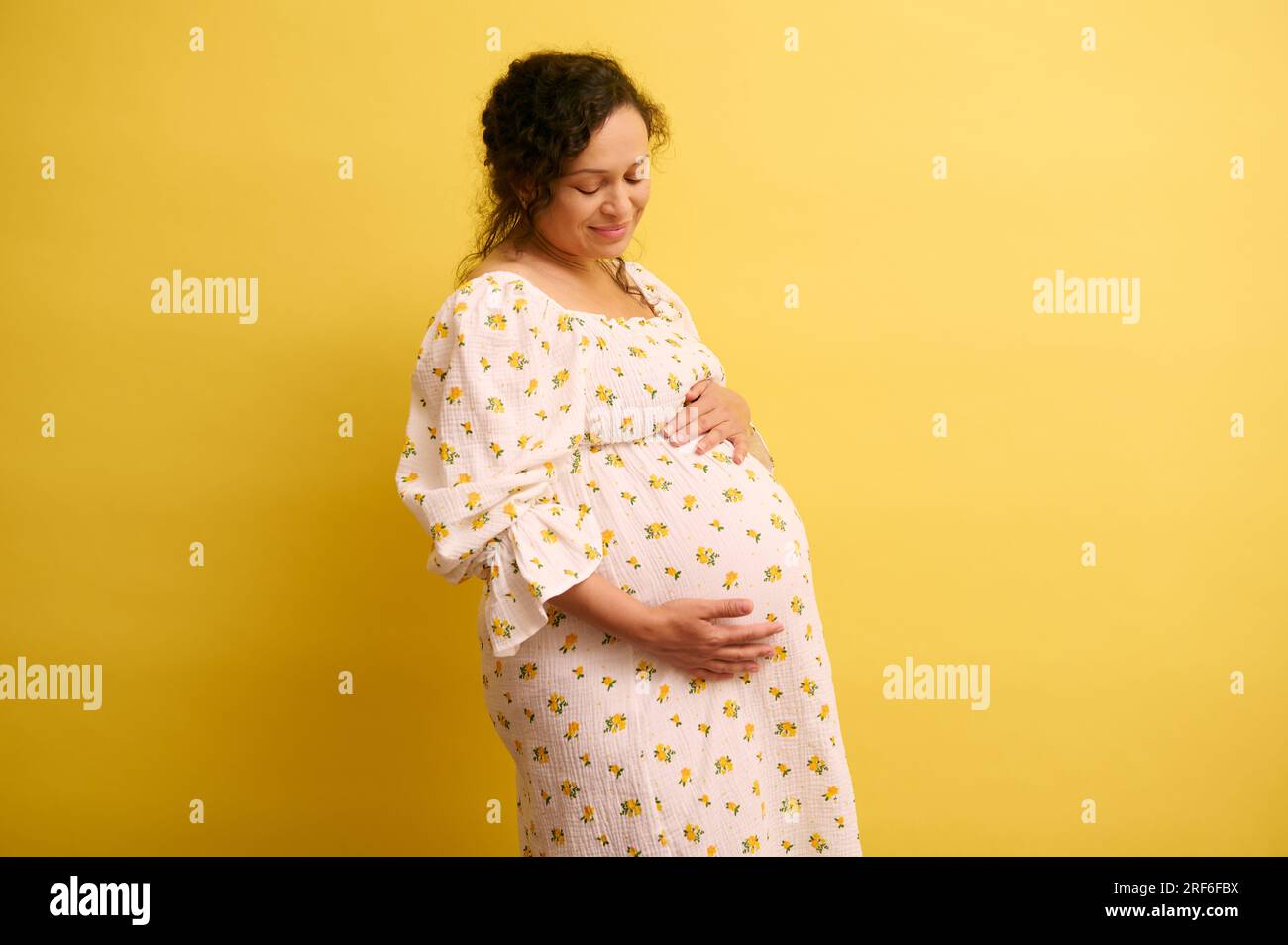 Confident serene charming middle aged ethnic pregnant woman, expecting ...
