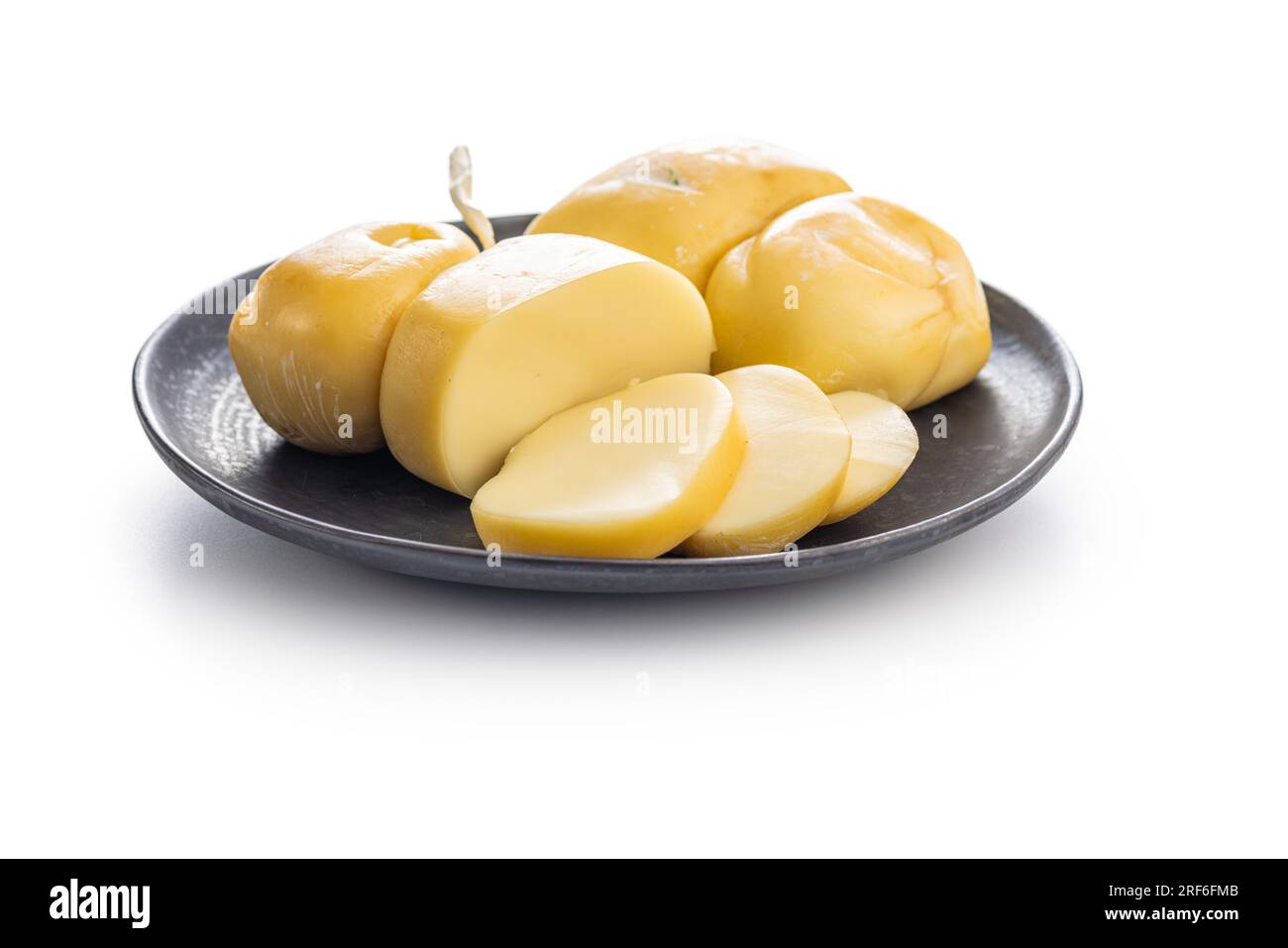Smoked scamorza cheese on plate isolated on the white background Stock ...