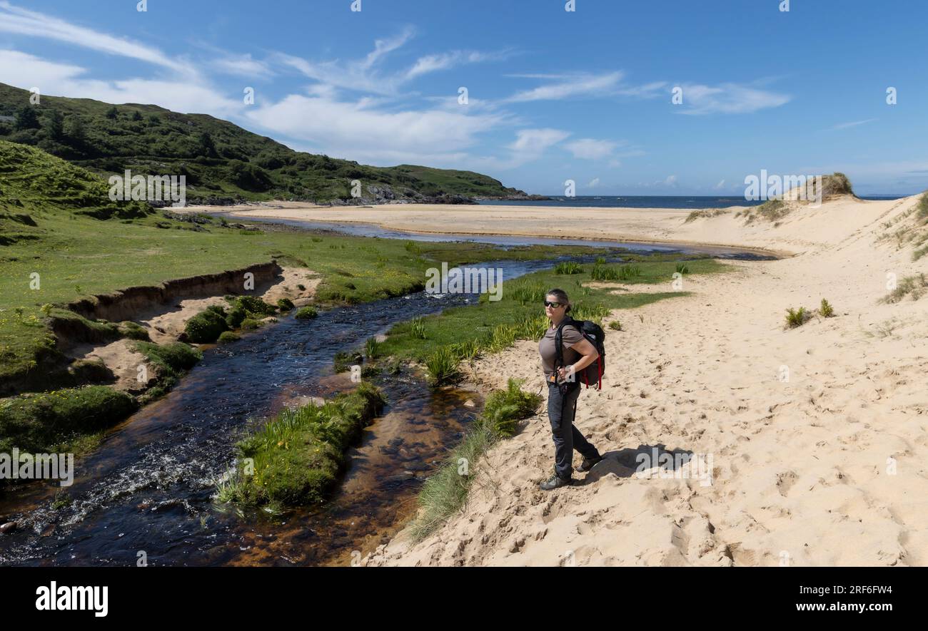 woman on Kiloran Bay on the isle of Colonsay in Scotland Stock Photo ...