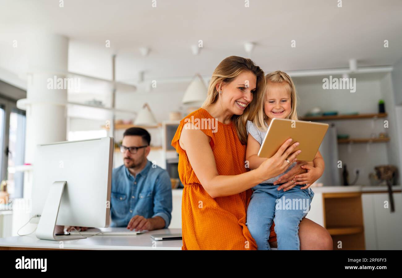 Device technology family online education concept. Happy family with ...