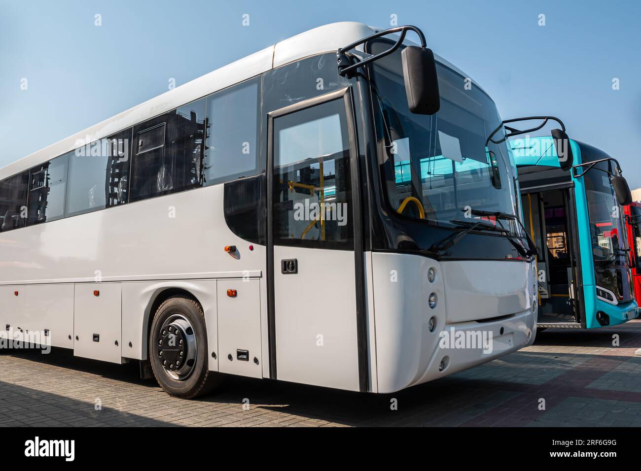 Modern city buses at the parking lot Stock Photo - Alamy