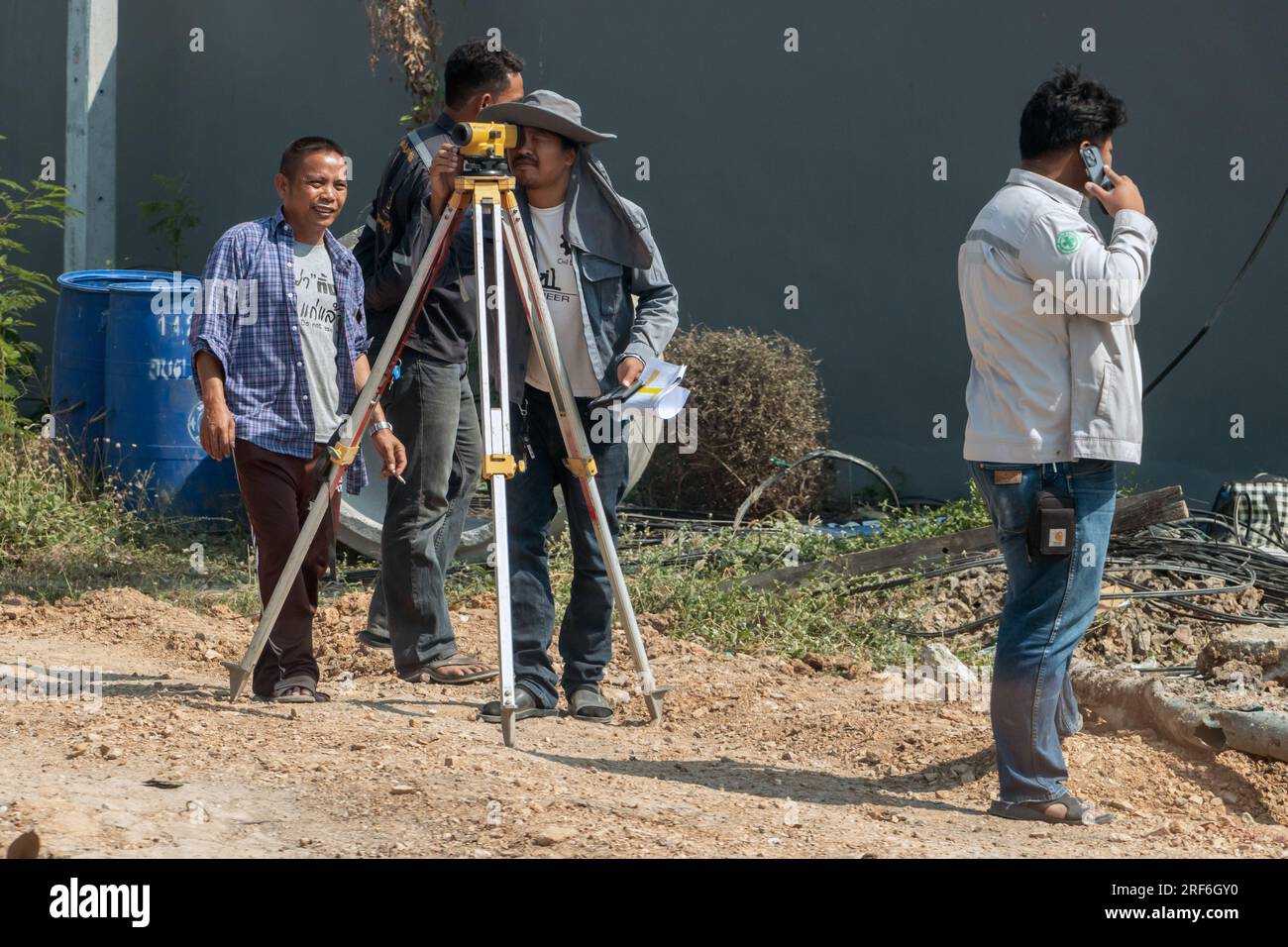BANGKOK, THAILAND, FEB 26 2023, Construction workers use A optical ...
