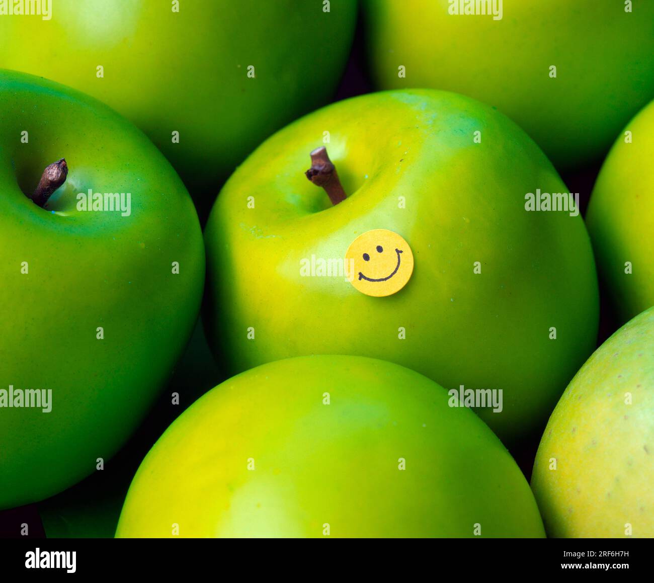 Apples and smiley label Stock Photo - Alamy