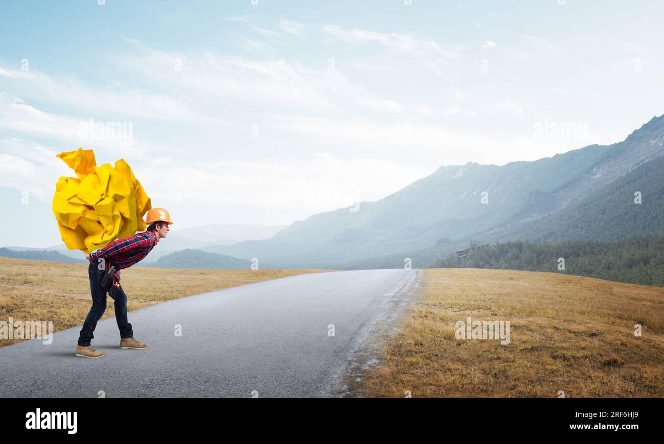 Engineer man carry load Stock Photo - Alamy