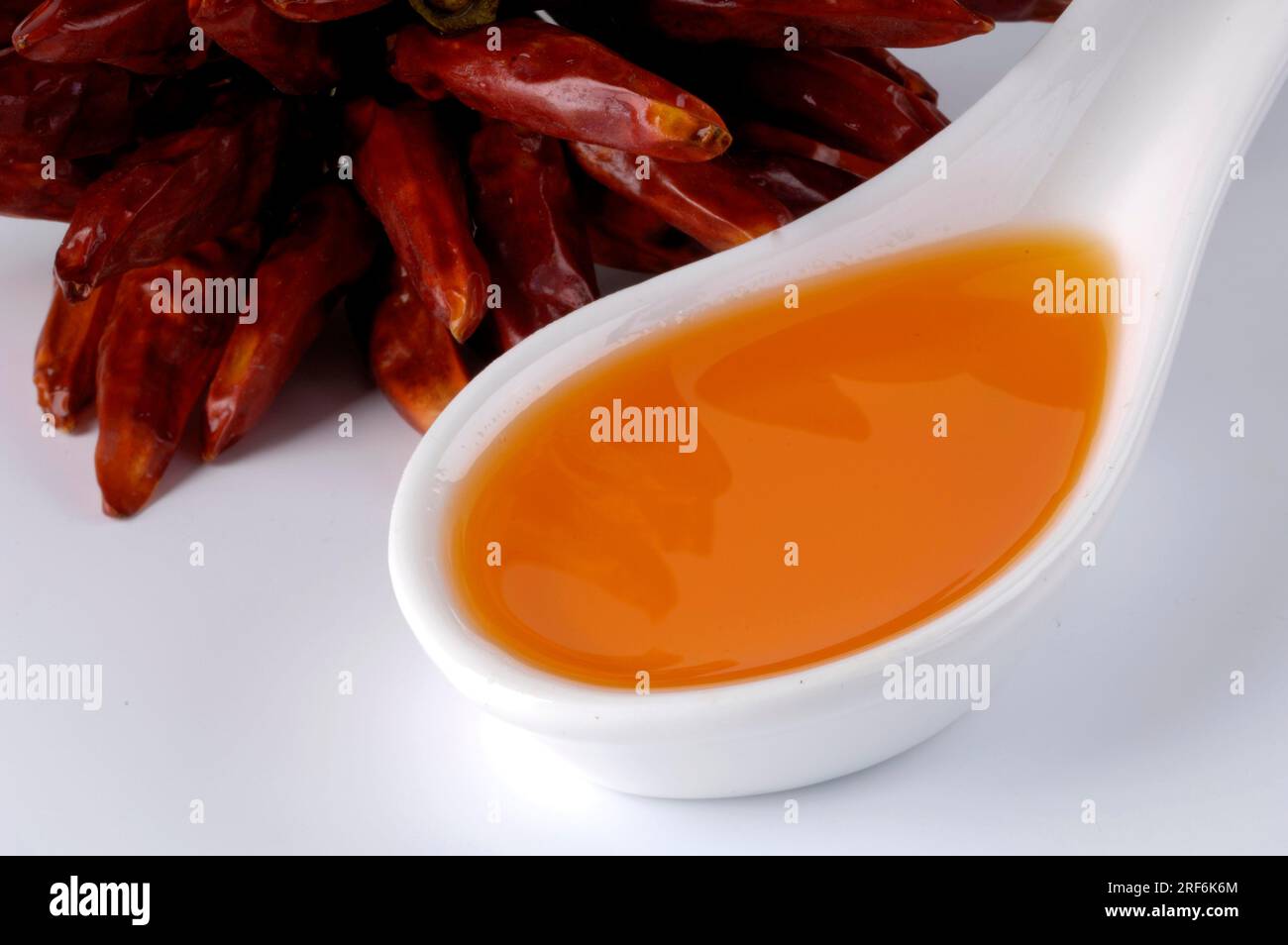 Chili oil (Capsicum frutescens), red pepper, cayenne pepper, chili ...