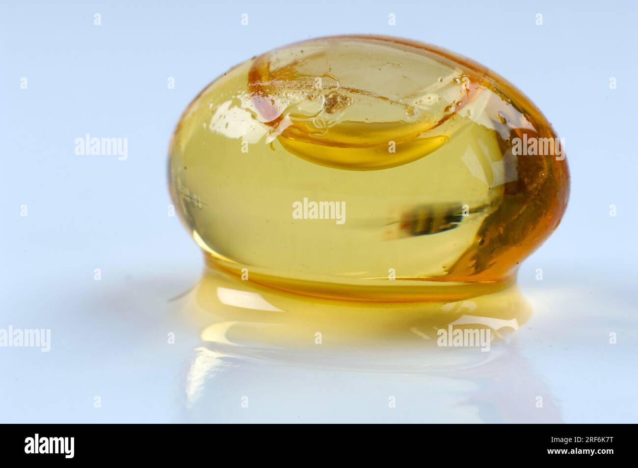 Salmon oil capsule Stock Photo - Alamy