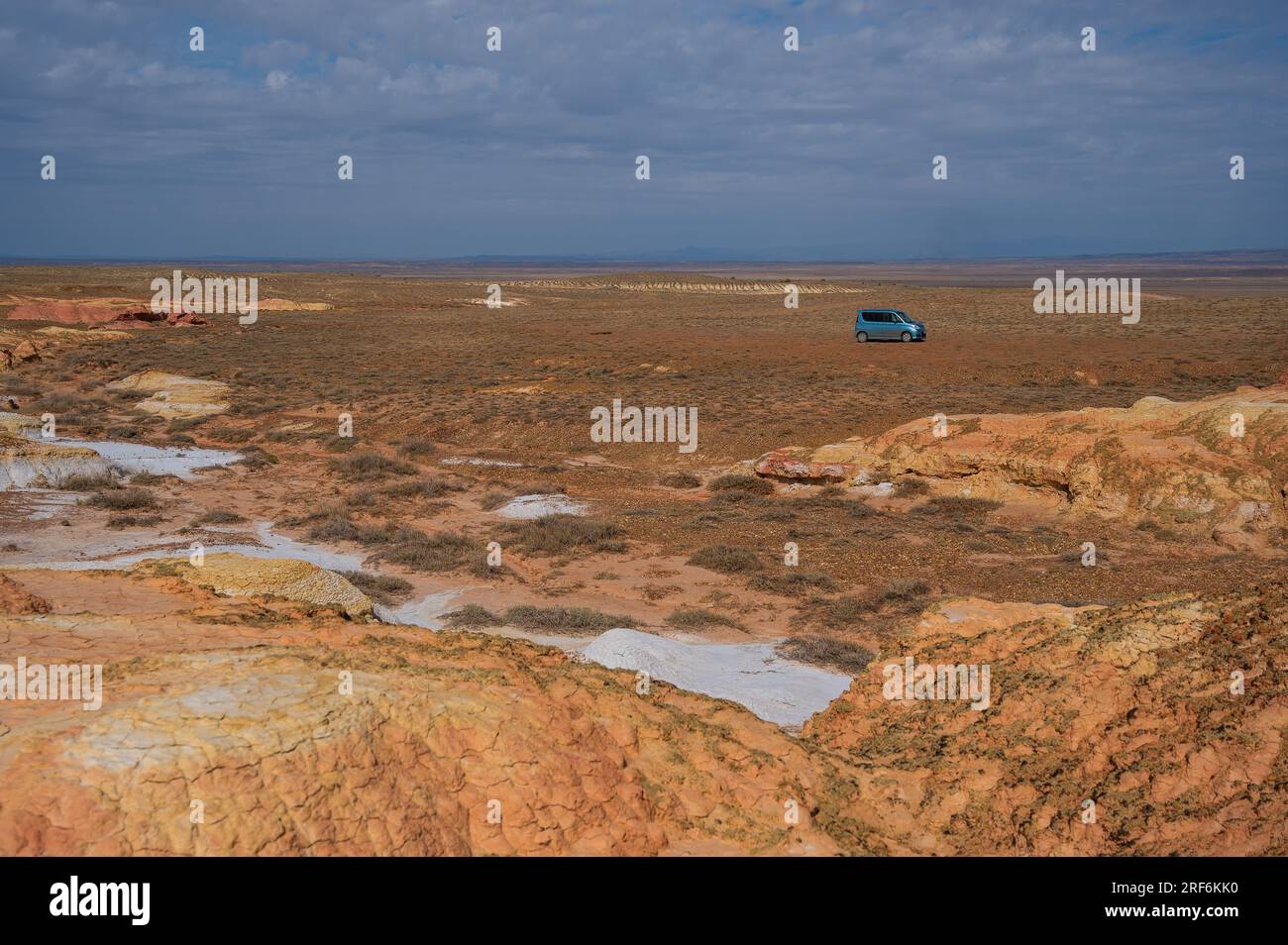 Landscape of multi-colored clay dunes. Mars on earth. Blue car Stock ...