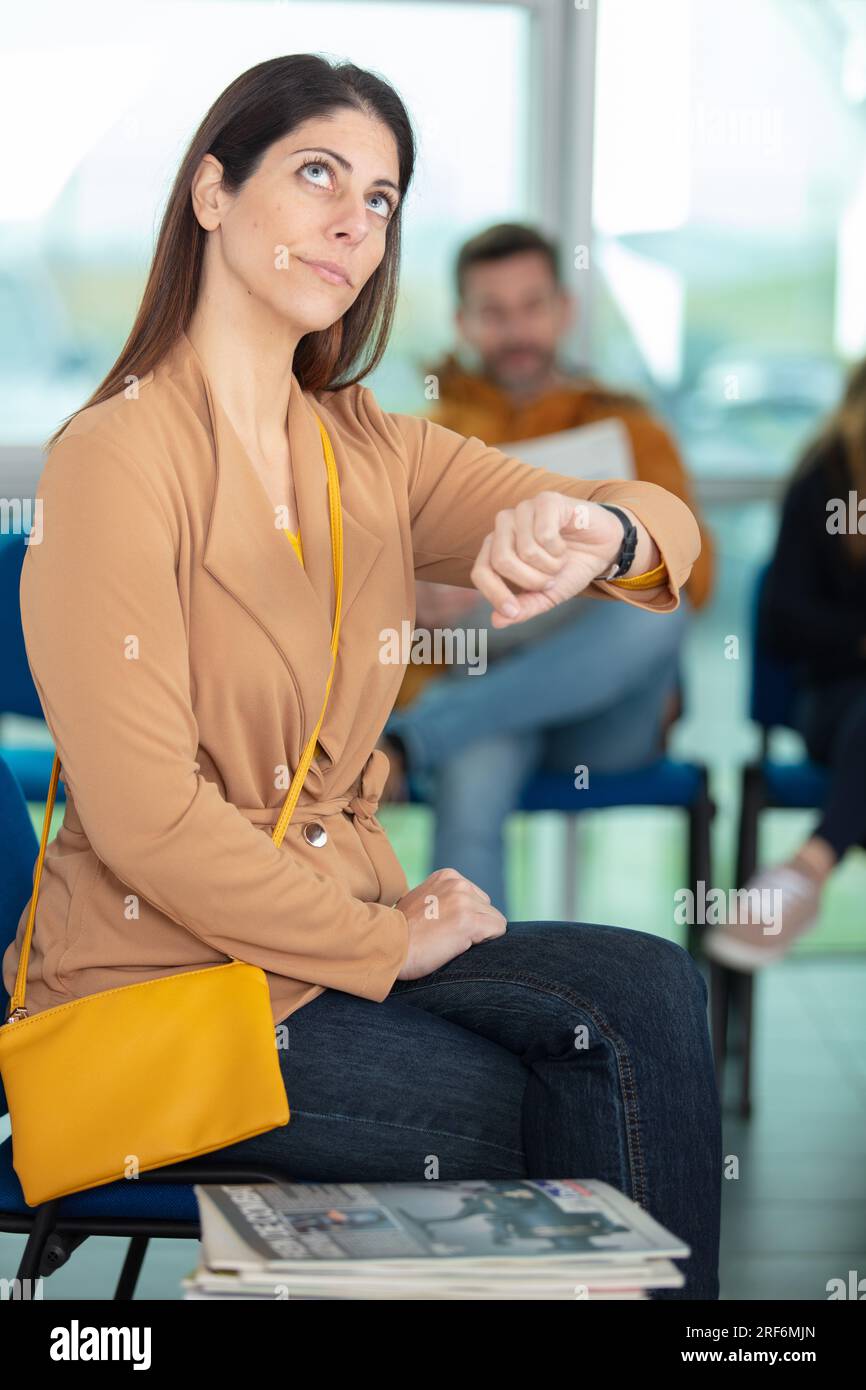 Adult looking watch sitting hospital hi-res stock photography and ...