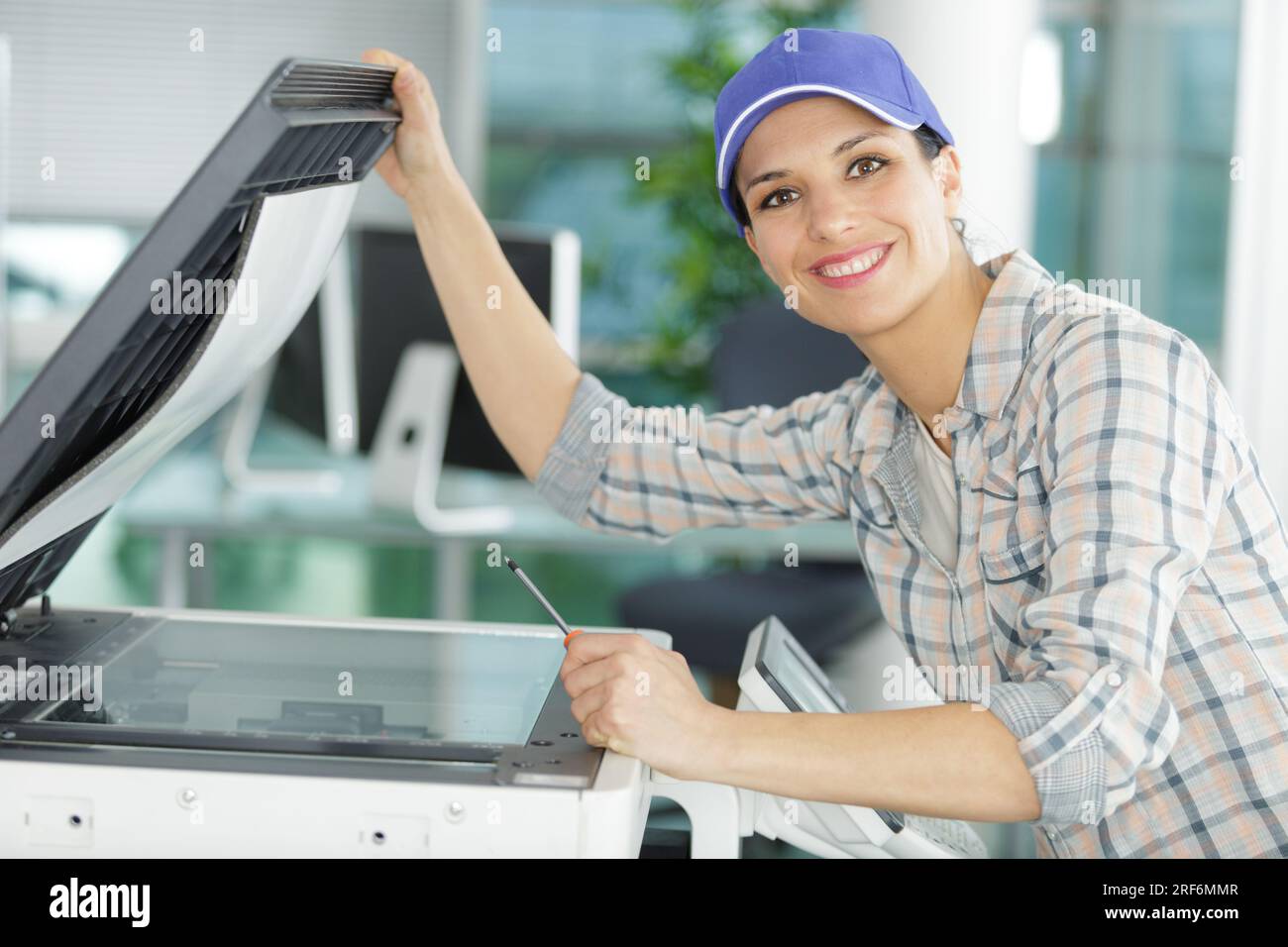 Latina worker woman scanning hi-res stock photography and images - Alamy