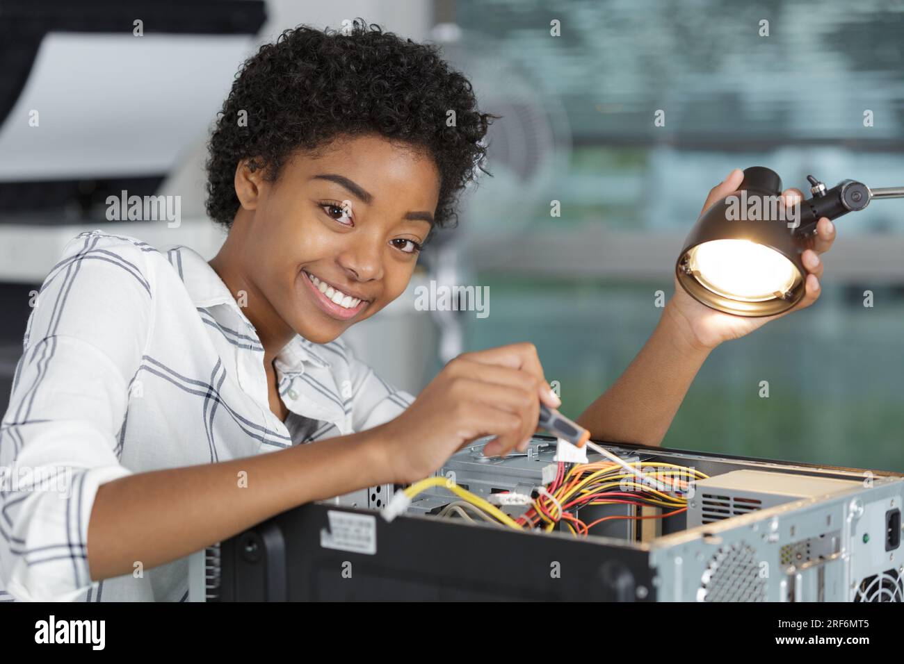 happy computer tecnician looking at camera Stock Photo - Alamy