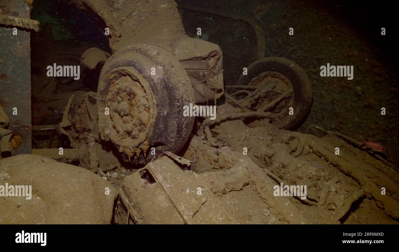 Overturned car and other cargo inside hold of ferry Salem Express ...