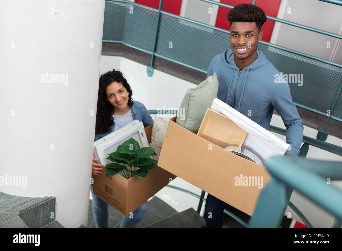Man carrying boxes stairs hi-res stock photography and images - Alamy