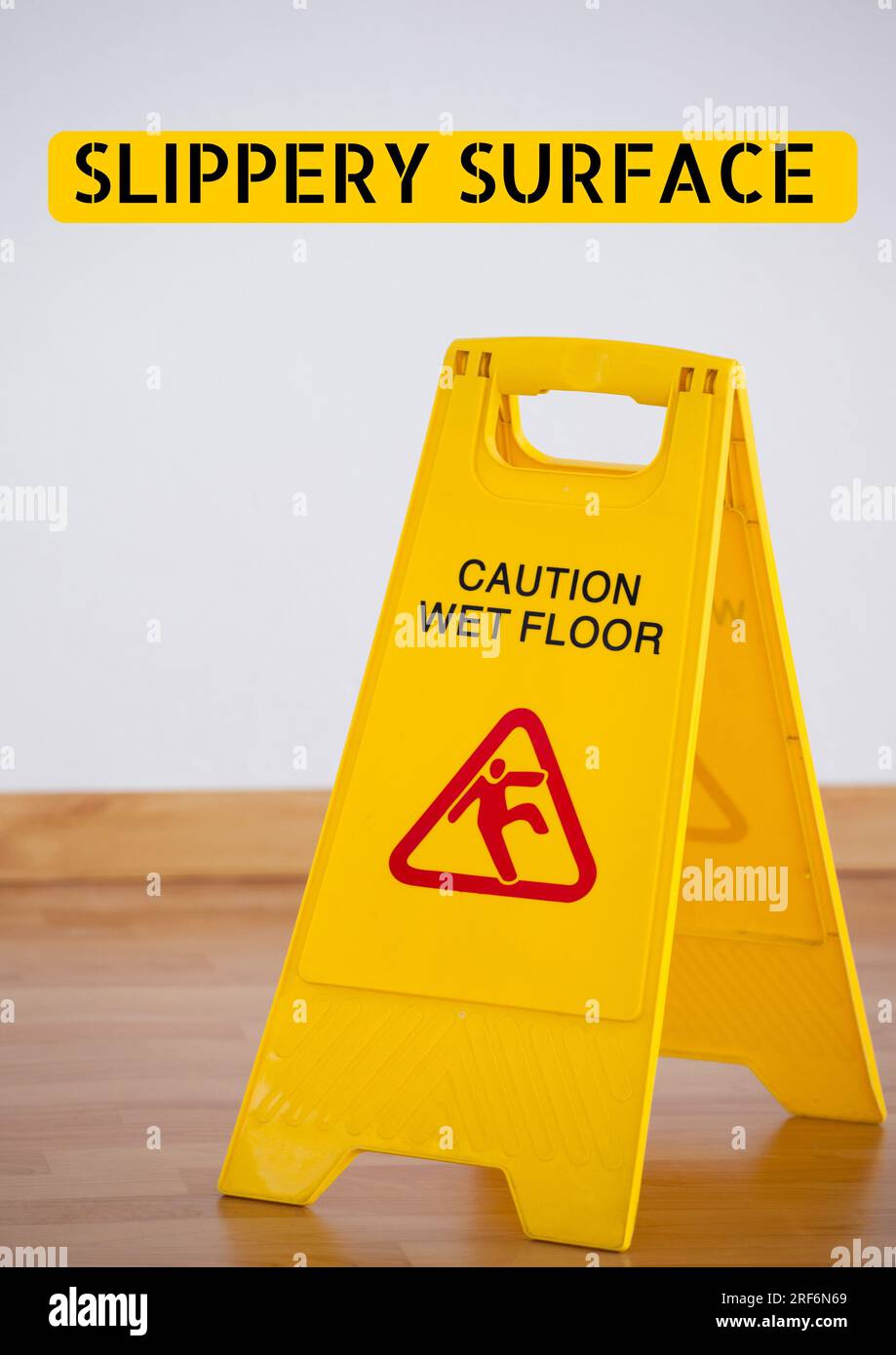 Composition of slippery surface text over yellow caution sign Stock ...