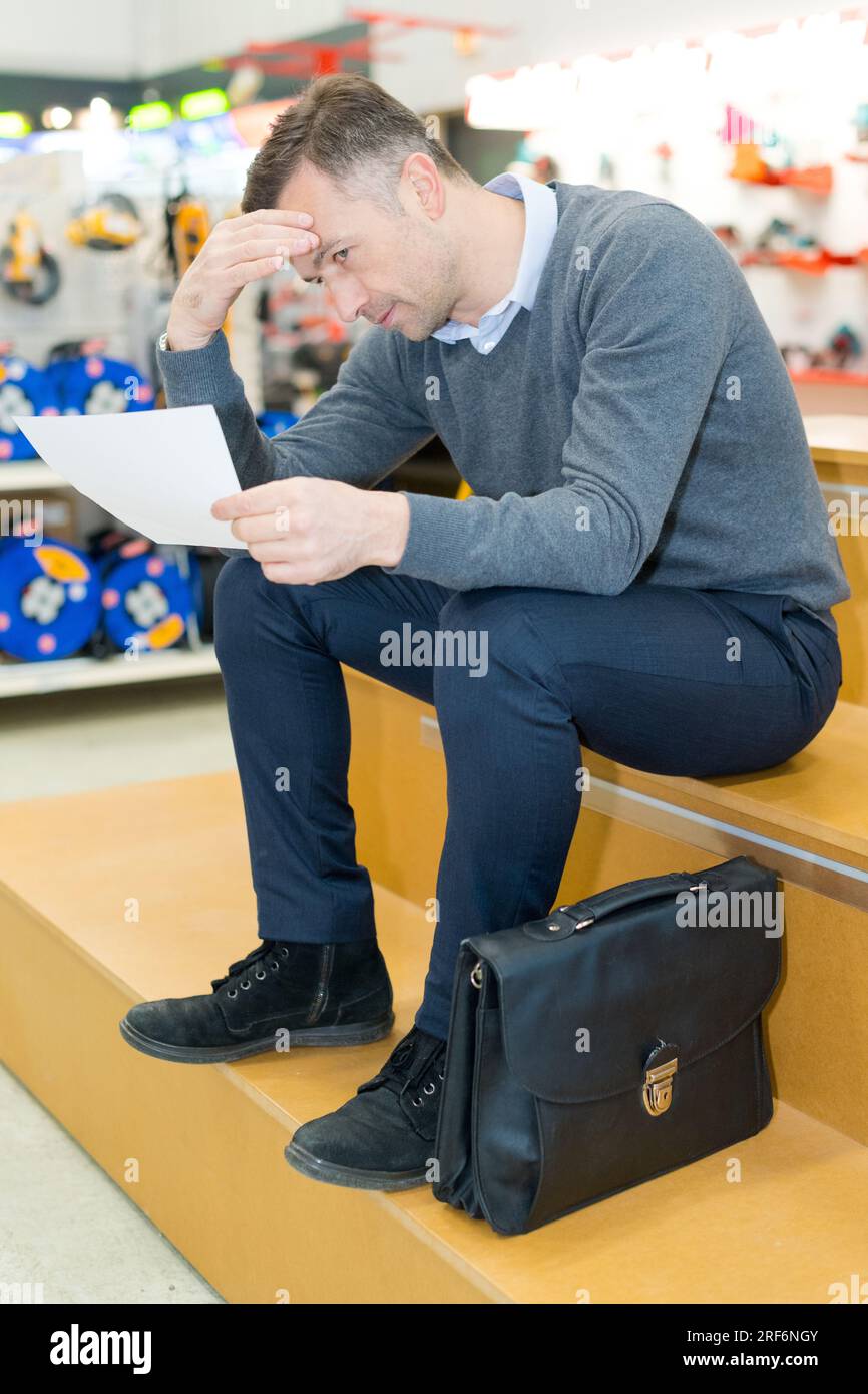 man waiting bored and frustrated Stock Photo - Alamy