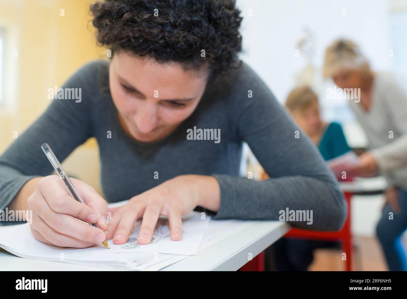 female university student taking notes Stock Photo - Alamy
