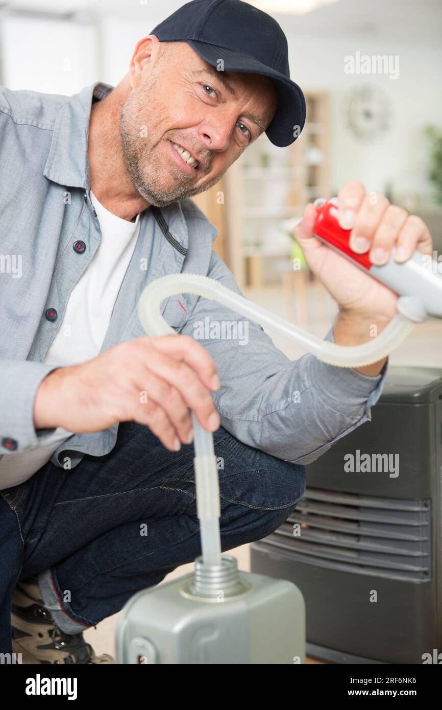 Man filling domestic oil tank hi-res stock photography and images - Alamy